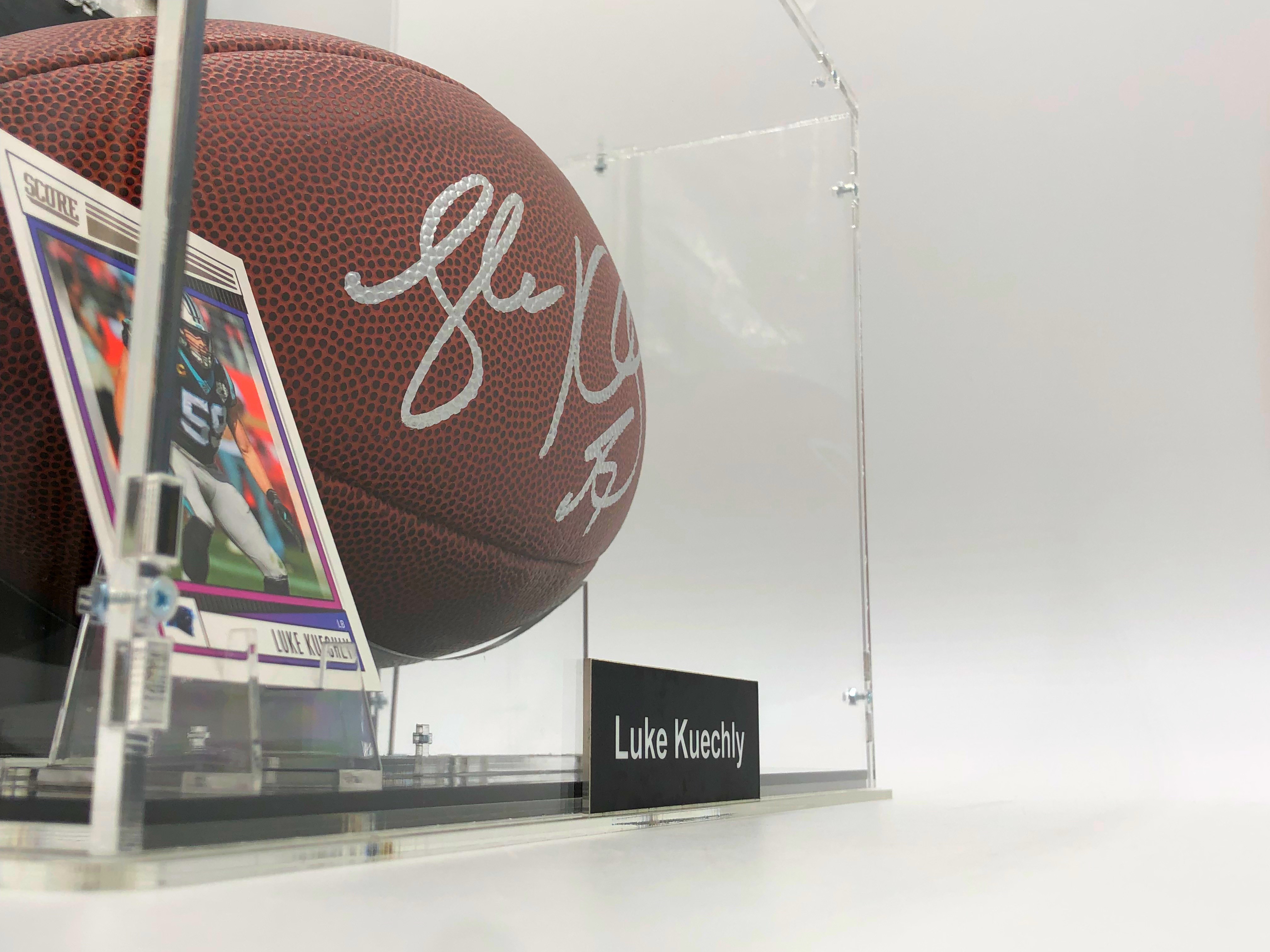 Luke Kuechly Signed Football In Display Case - CharityStars